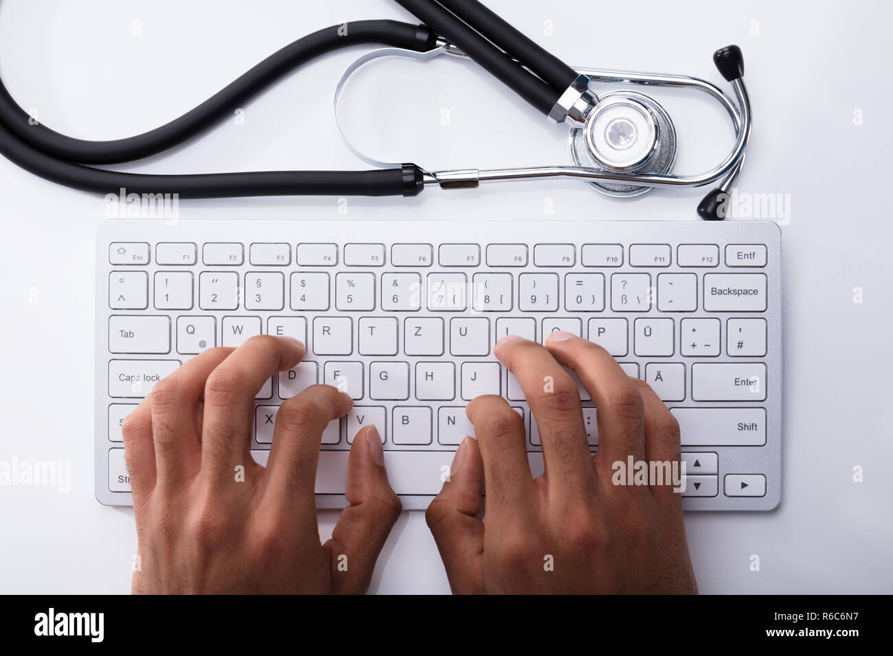 Doctor Typing On Computer Keyboard Stock Photo - Alamy
