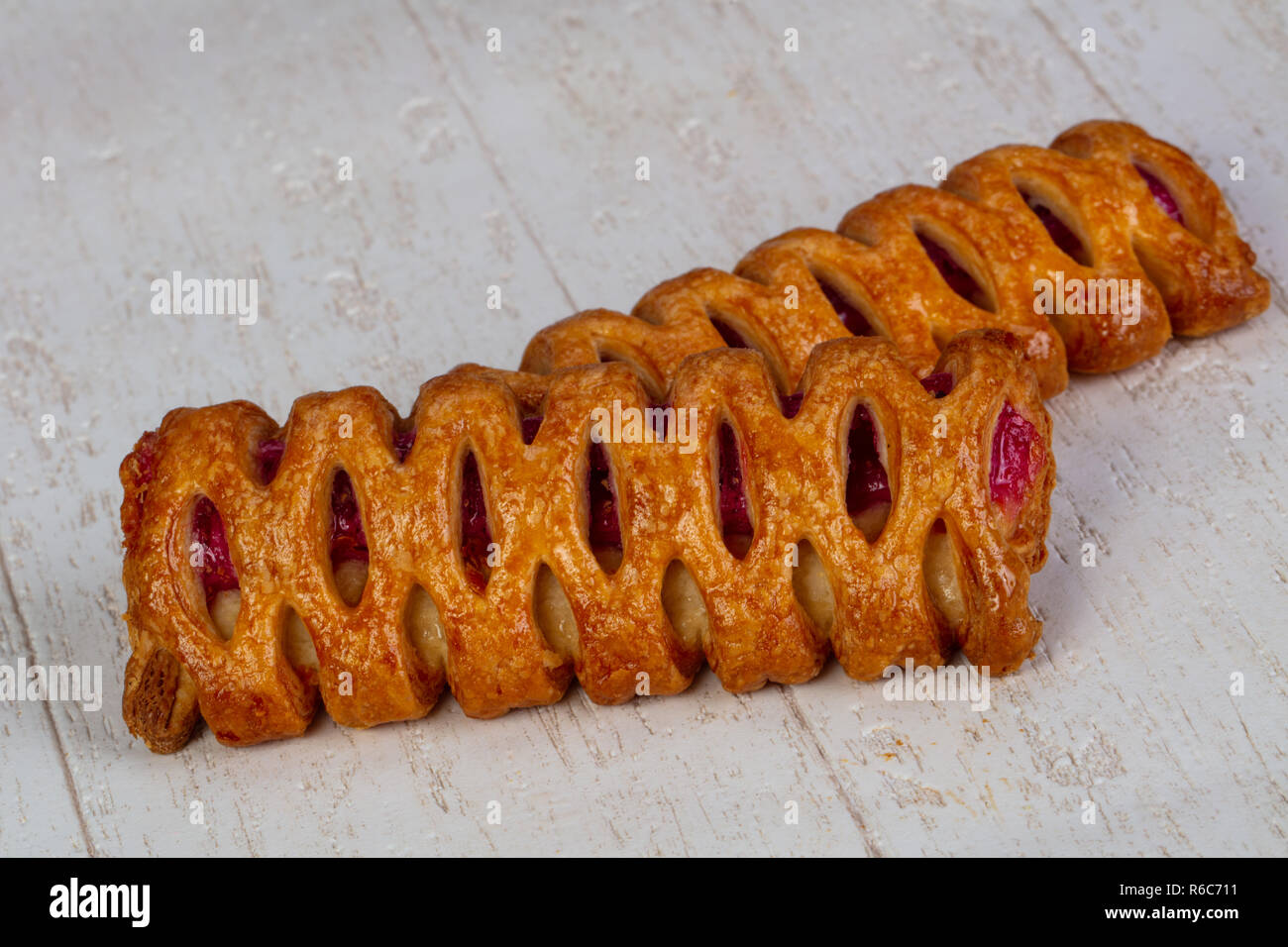 Delicious puff pastry strudel with jam Stock Photo - Alamy