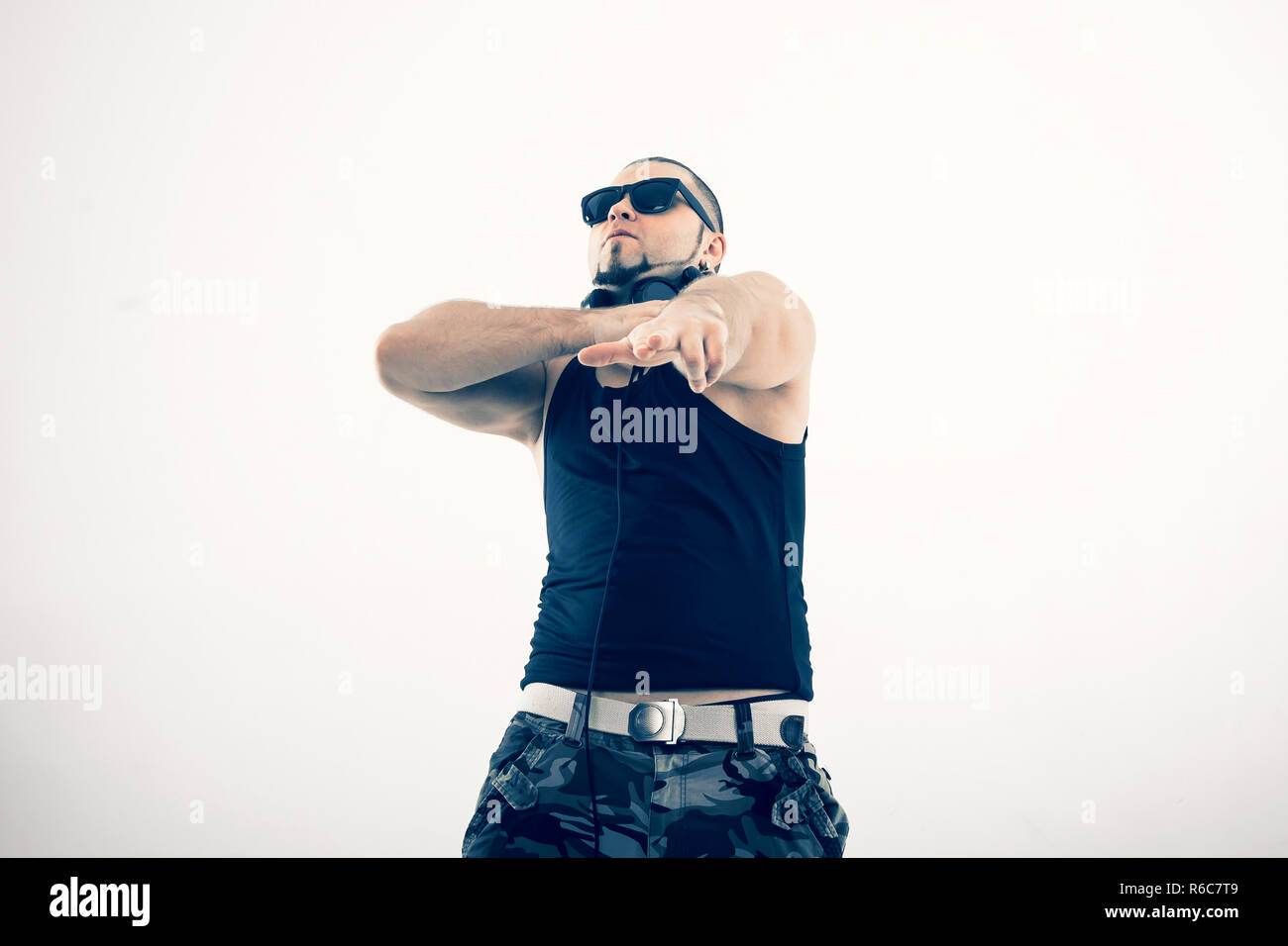 emotional and charismatic DJ - rapper in headphones takes the ra Stock ...