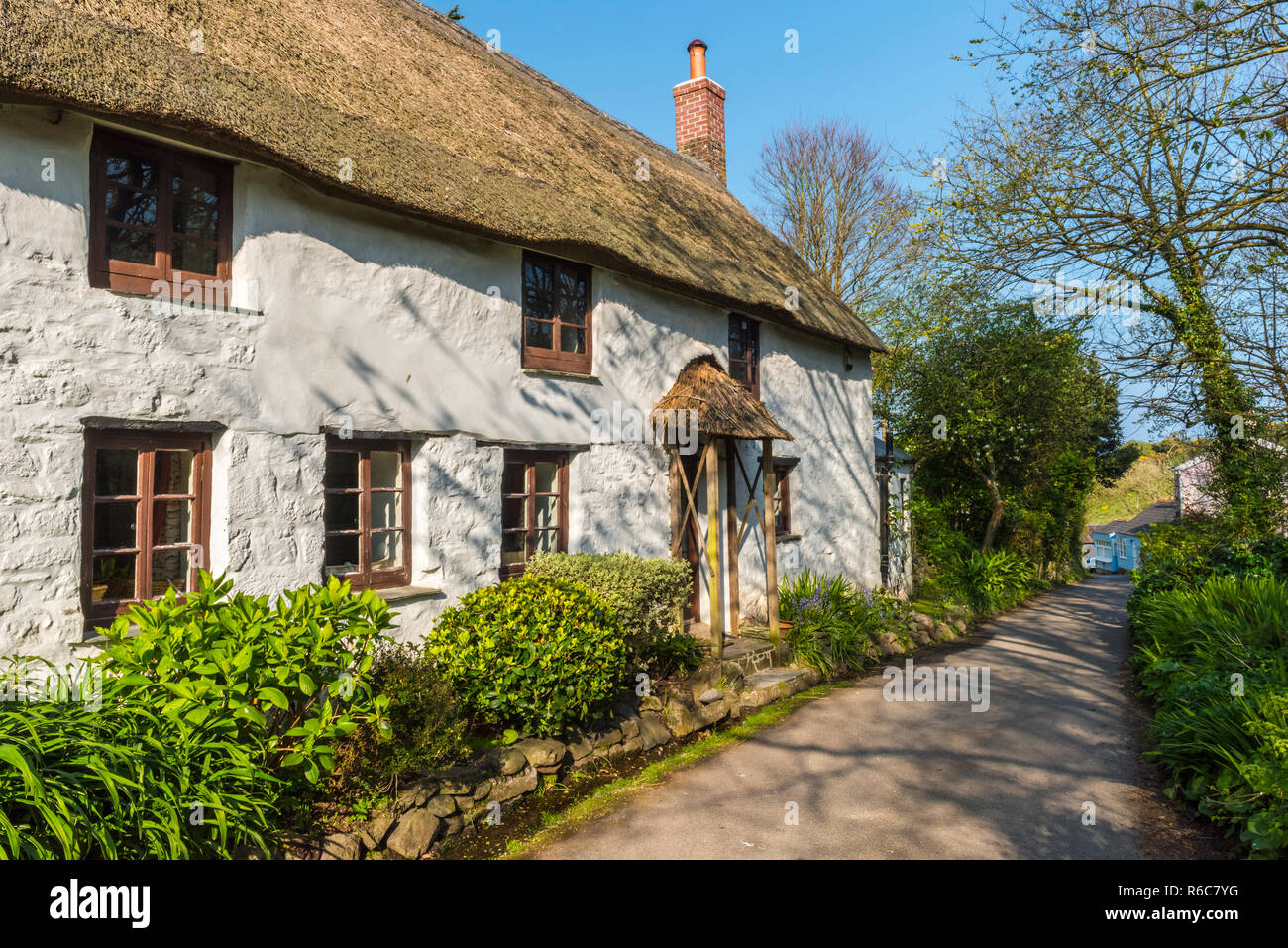 A picturesque thatched cottage on a quiet lane in Church Cove, on the ...