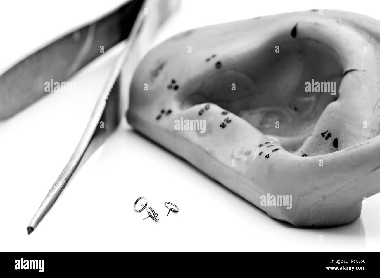 Acupuncture Needles With Ear Model Stock Photo - Alamy