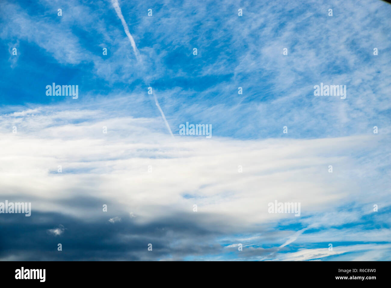 Blue Sky With Layers Of Clouds Stock Photo - Alamy