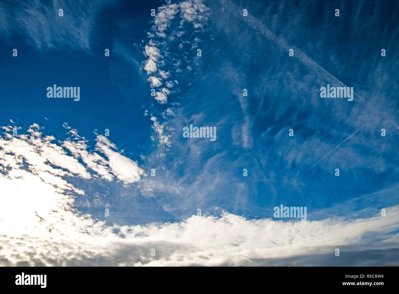 Blue Sky With Layers Of Clouds Stock Photo - Alamy