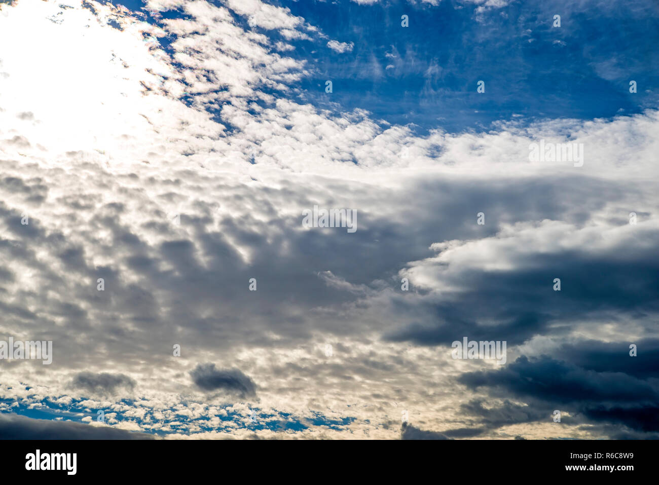 Blue Sky With Layers Of Clouds Stock Photo - Alamy