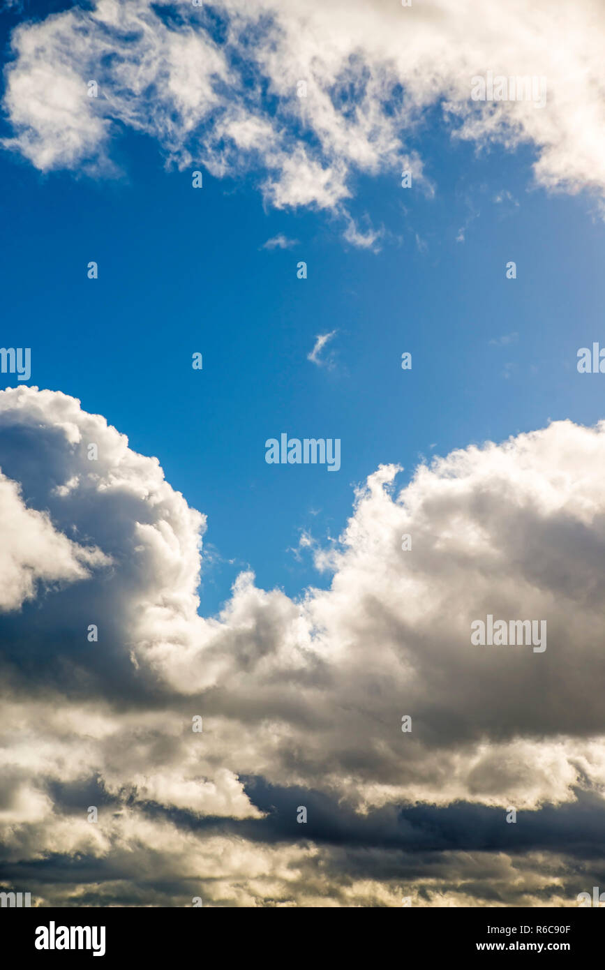 Blue Sky With Layers Of Clouds Stock Photo - Alamy