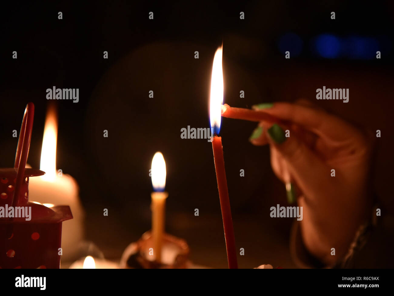 divination ritual a few different candles in the night Stock Photo - Alamy