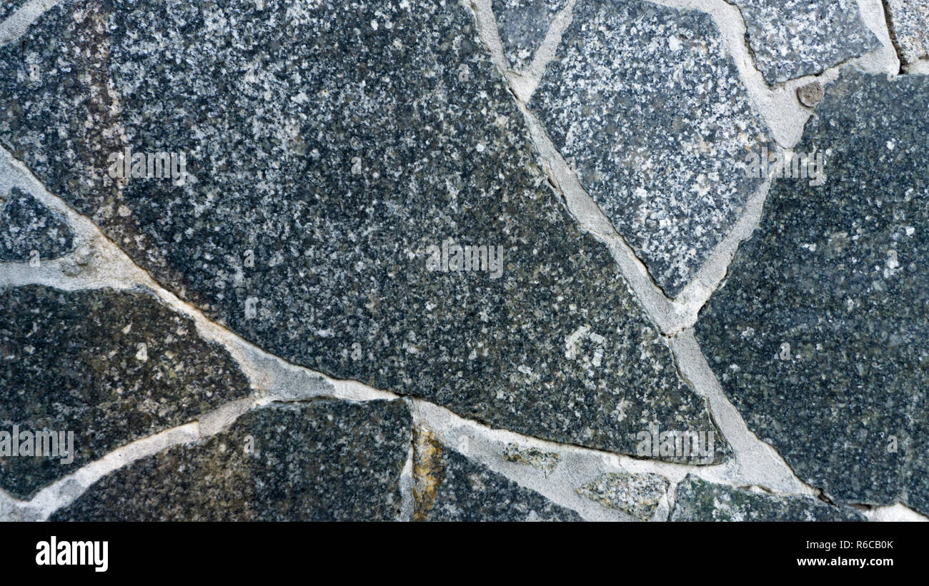 Natural stone granite background. Bright hard grey granite rock texture ...