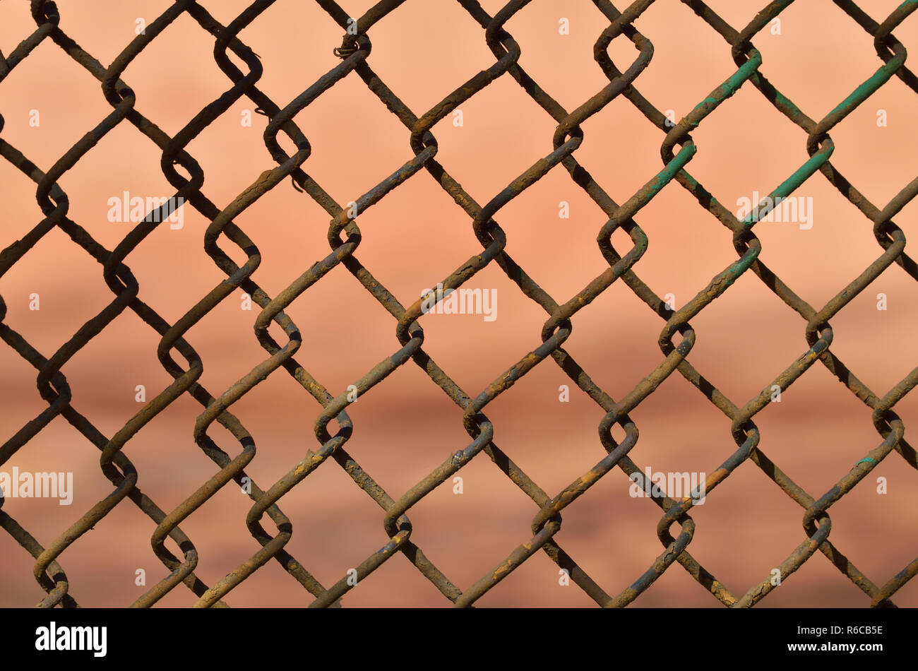 A fence made of iron net.The wire is twisted into a rigid mesh Stock ...