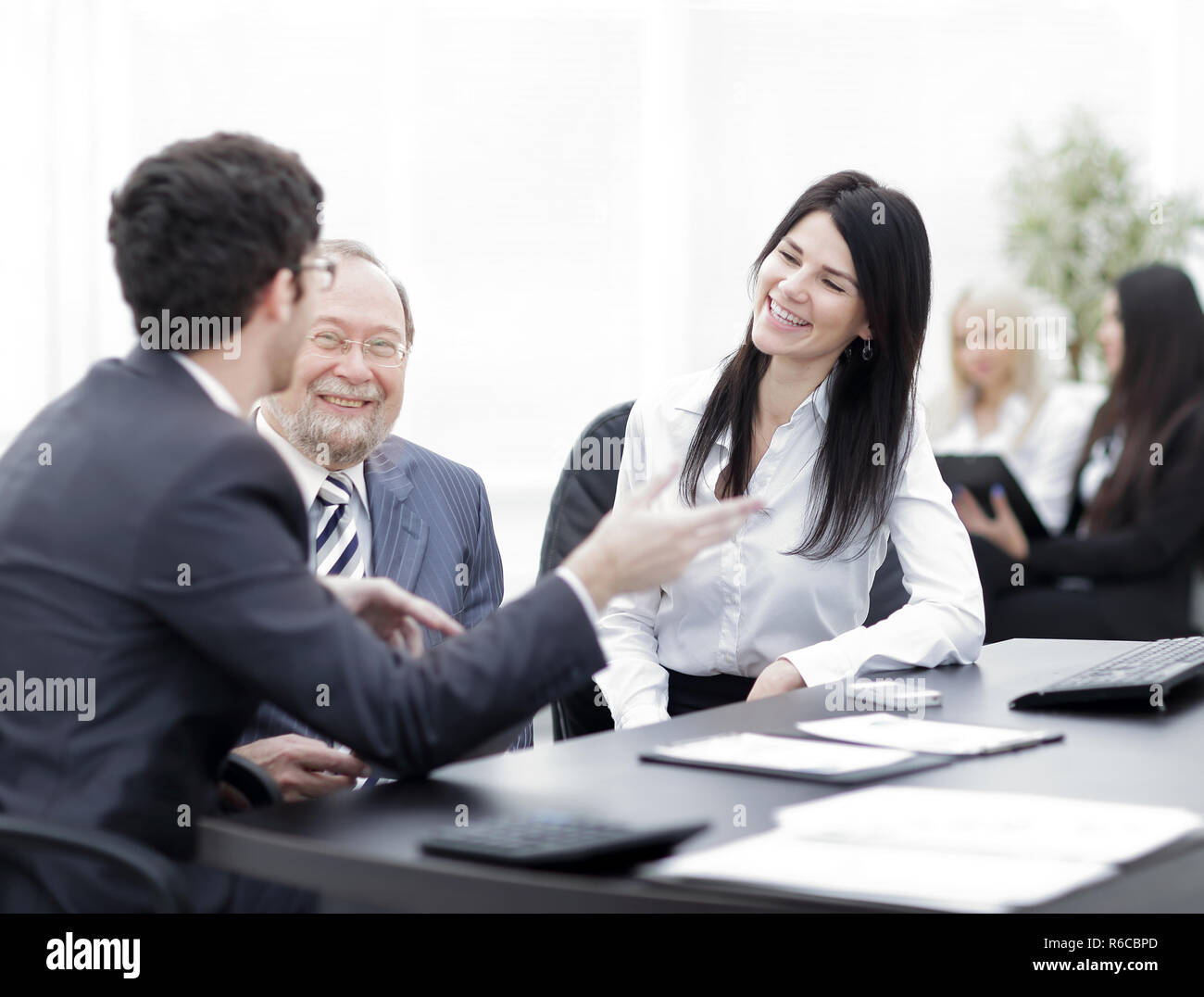 project Manager and staff talking at the Desk Stock Photo - Alamy