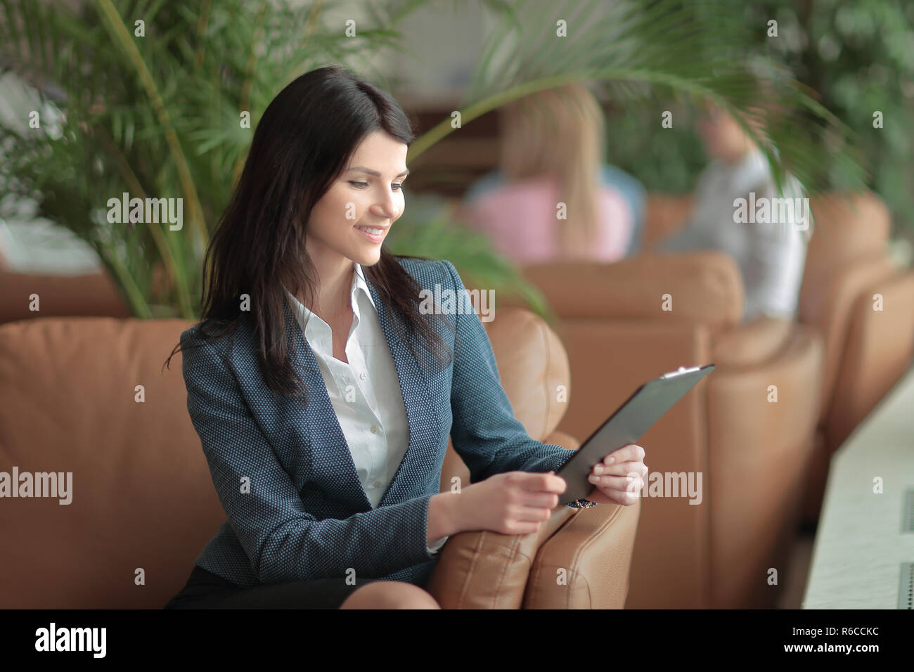 portrait of an Executive business woman with a clipboard on the ...