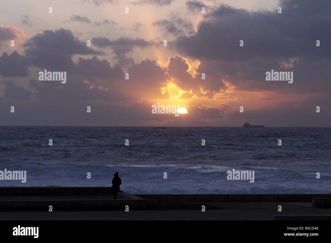 Beautiful moody sunset in the Portuguese Coast with red sunbeams Stock ...