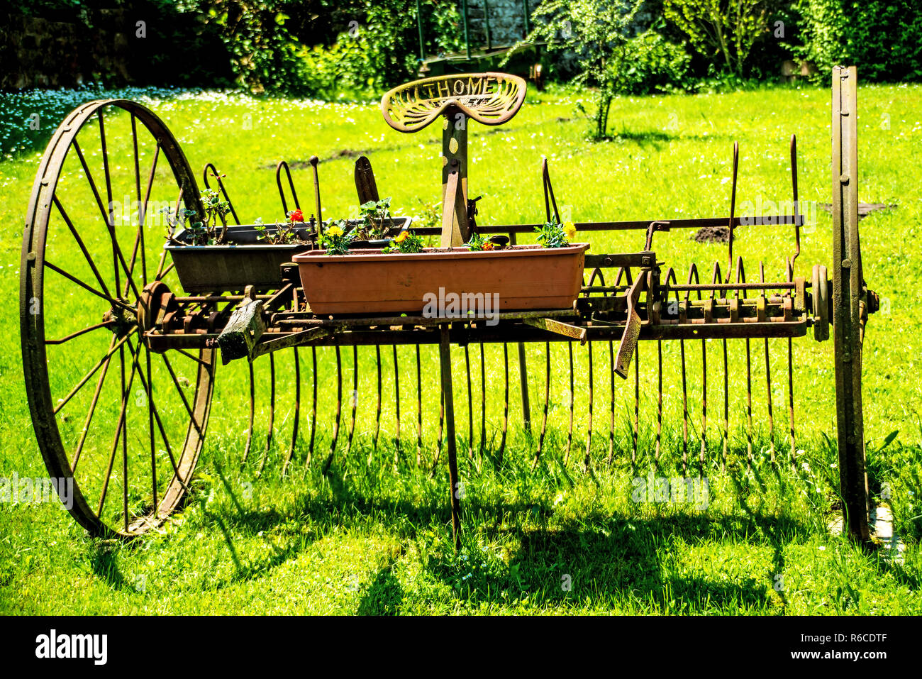 Tedder turning grass hi-res stock photography and images - Alamy