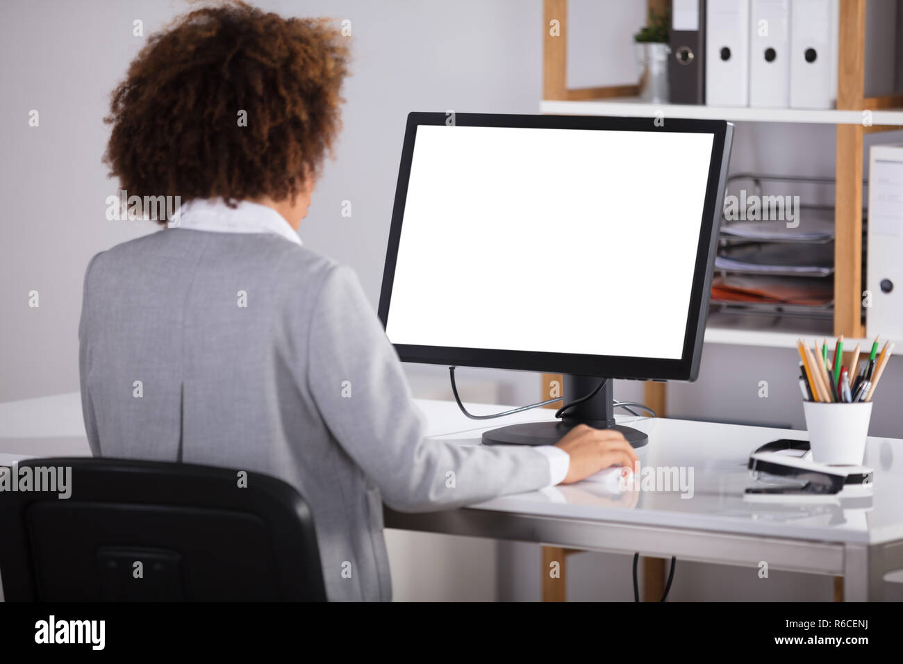 Businesswoman Looking At Blank Computer Screen Stock Photo - Alamy