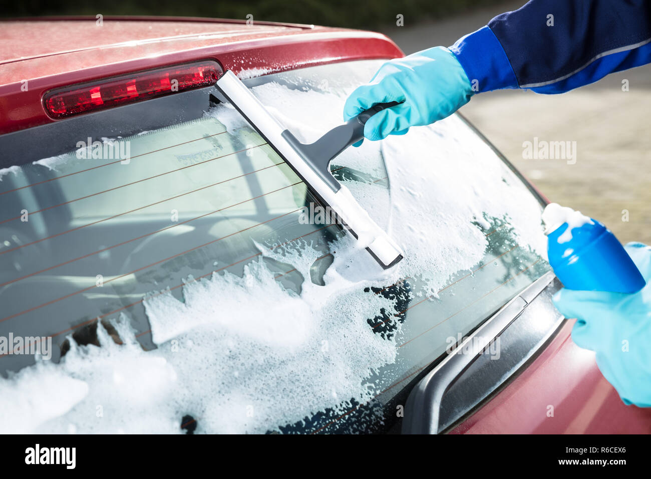 Person's Hand Washing Rear Windshield Stock Photo - Alamy