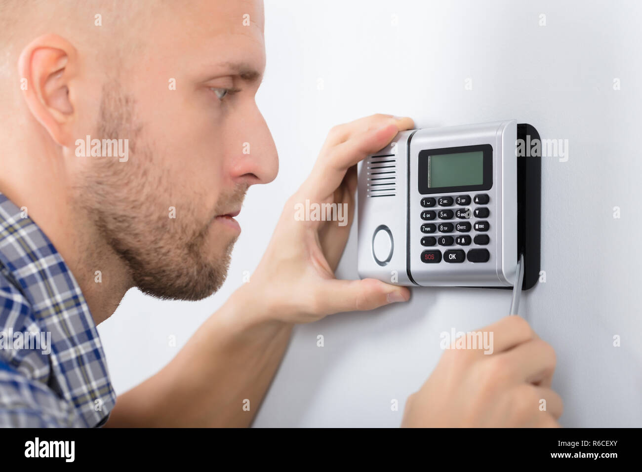 Male Technician Installing Security System Stock Photo - Alamy Male Technician Installing Security System Stock Photo - Alamy