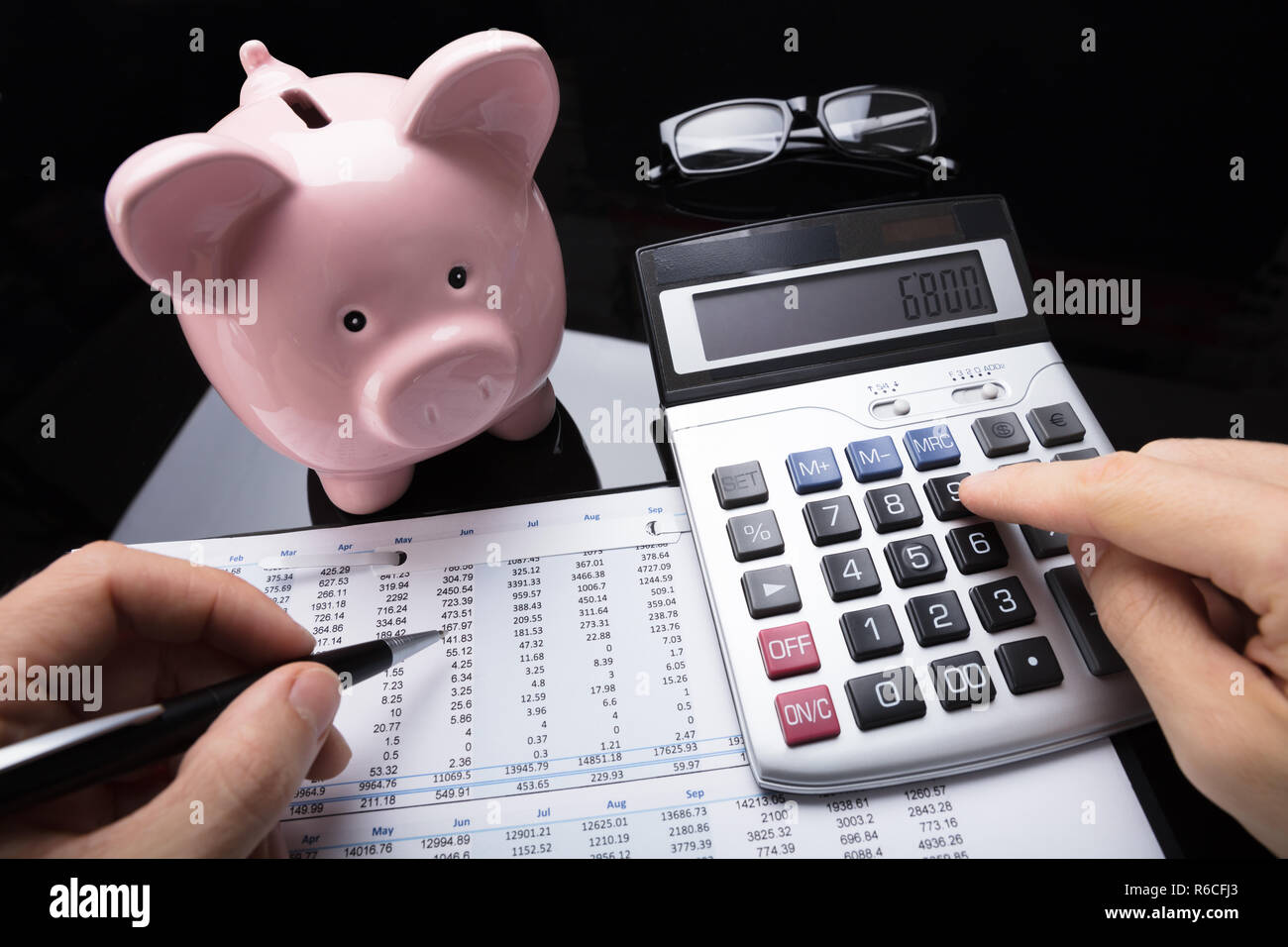Businessperson Calculating Financial Data With Calculator Stock Photo ...