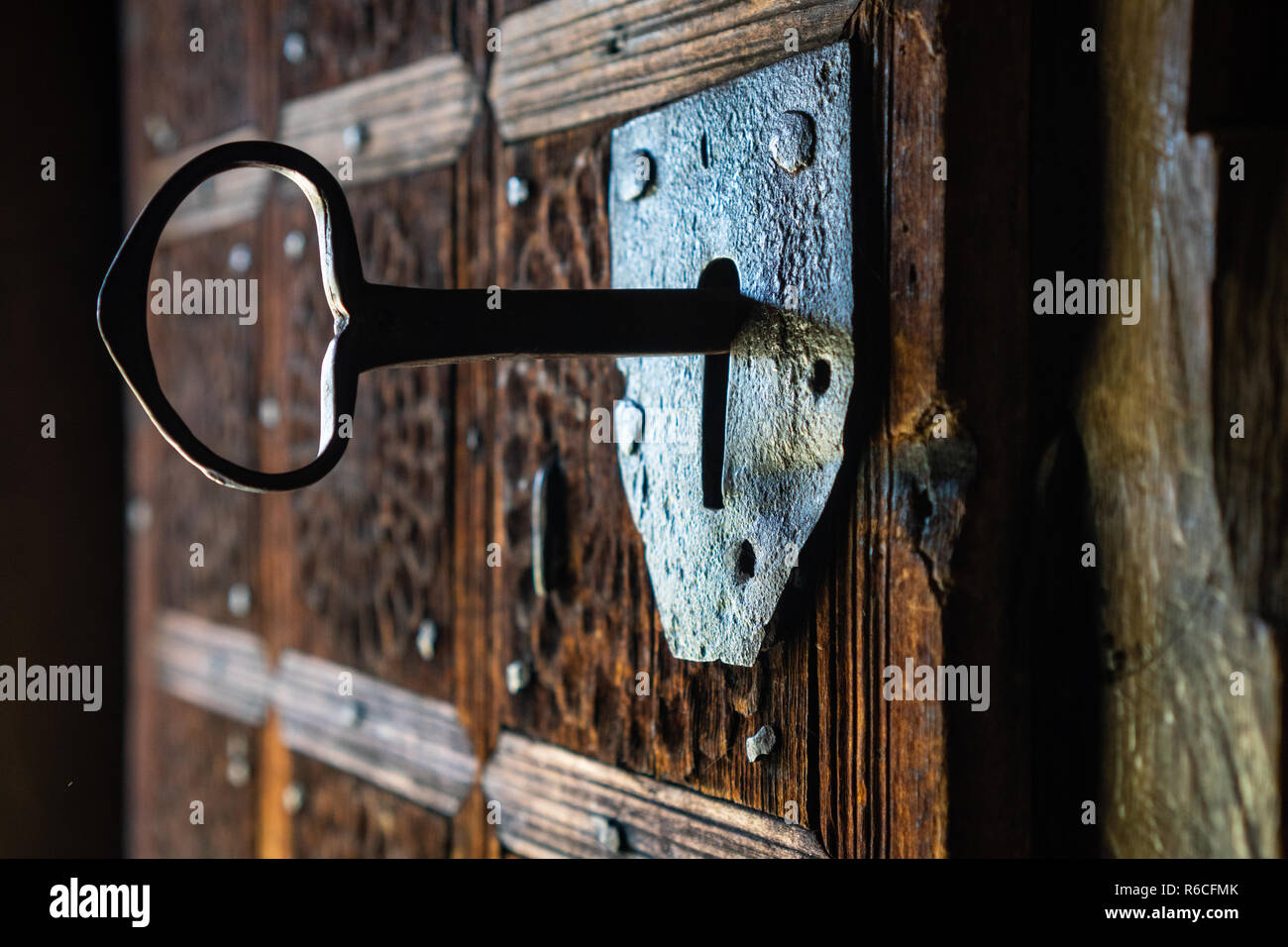Big key in rustic door of wooden church Stock Photo - Alamy