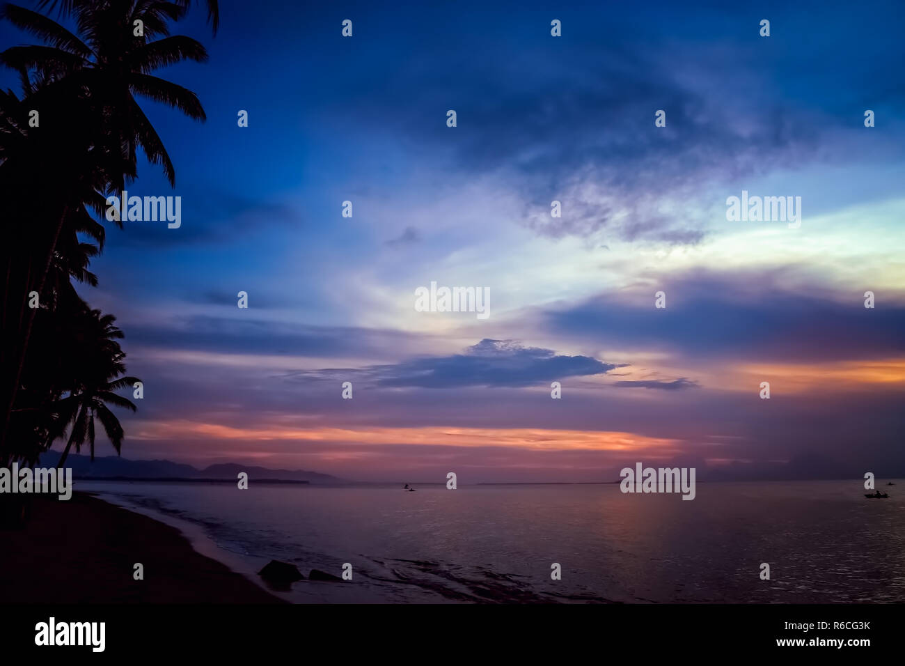 Bali beach sunset Stock Photo - Alamy