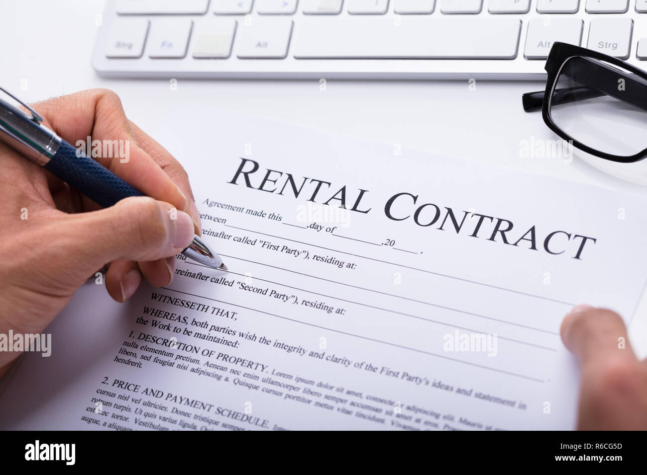 Person Filling Rental Contract Form Stock Photo - Alamy