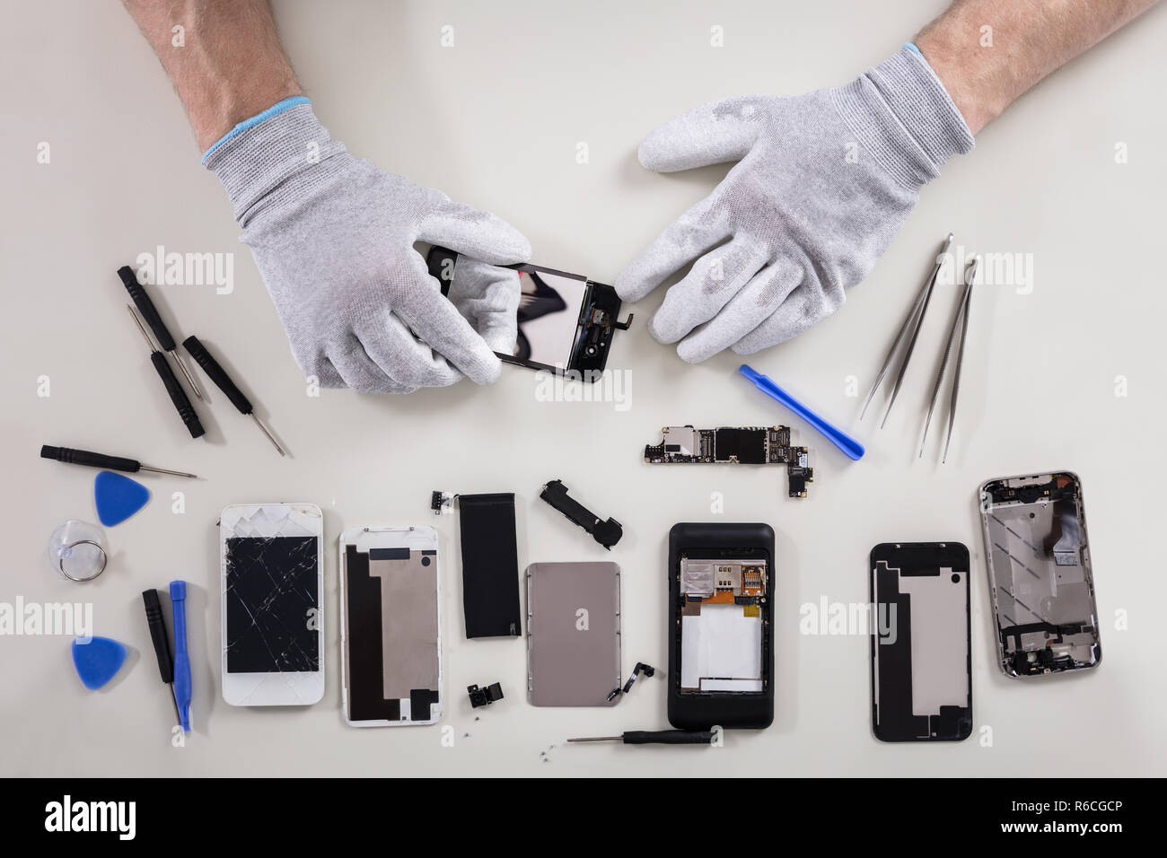 Person Repairing Mobile Phone Stock Photo - Alamy