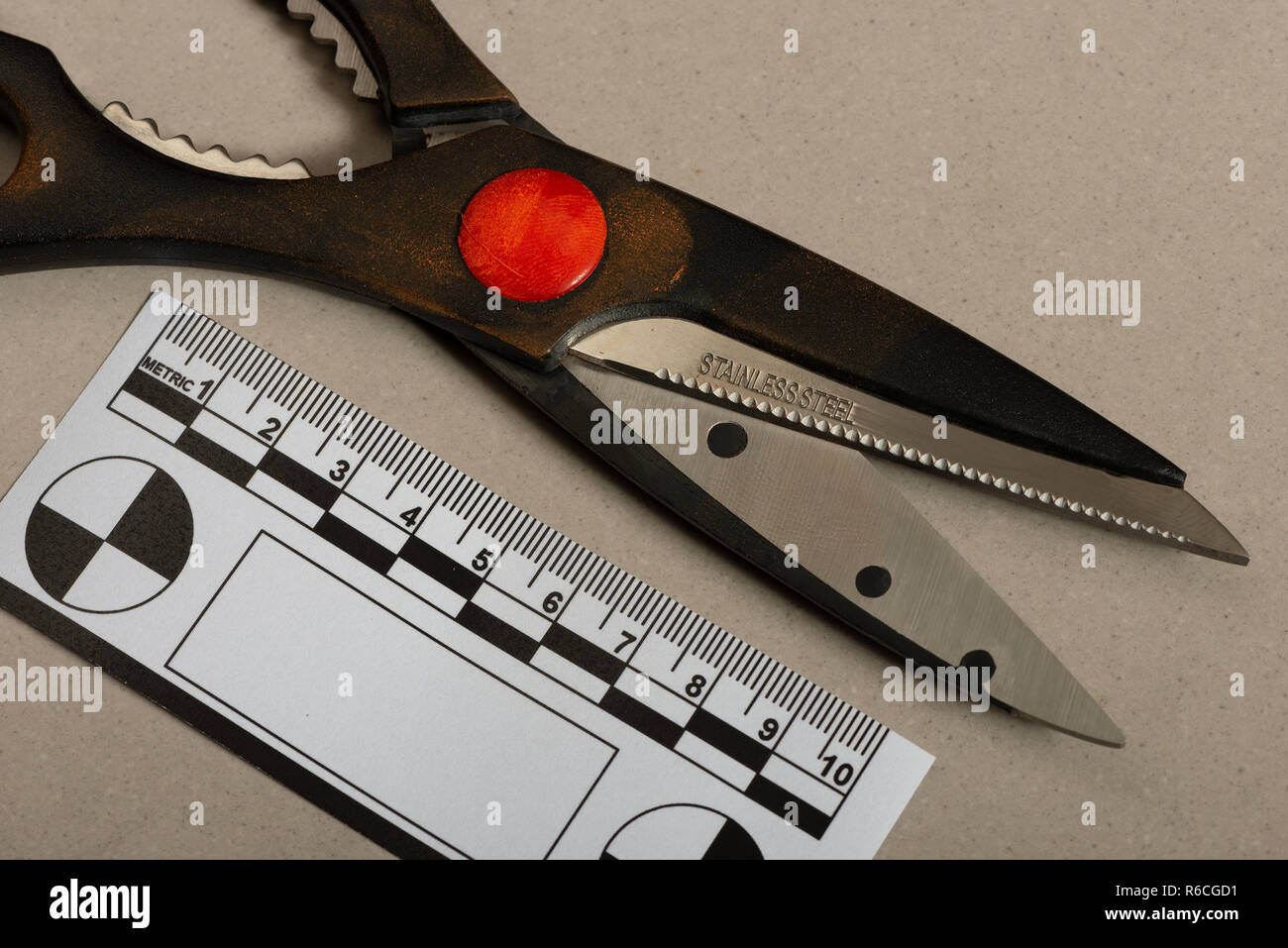 Difficult to seen under daylight, fingerprints on scissors glow orange ...