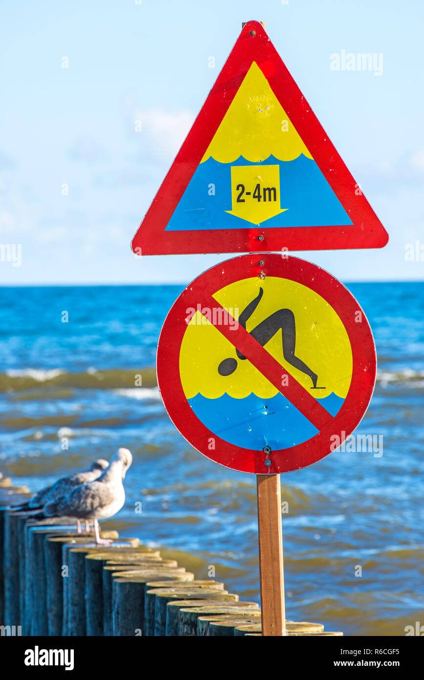 Groin In The Baltic Sea With Danger Sign Stock Photo - Alamy