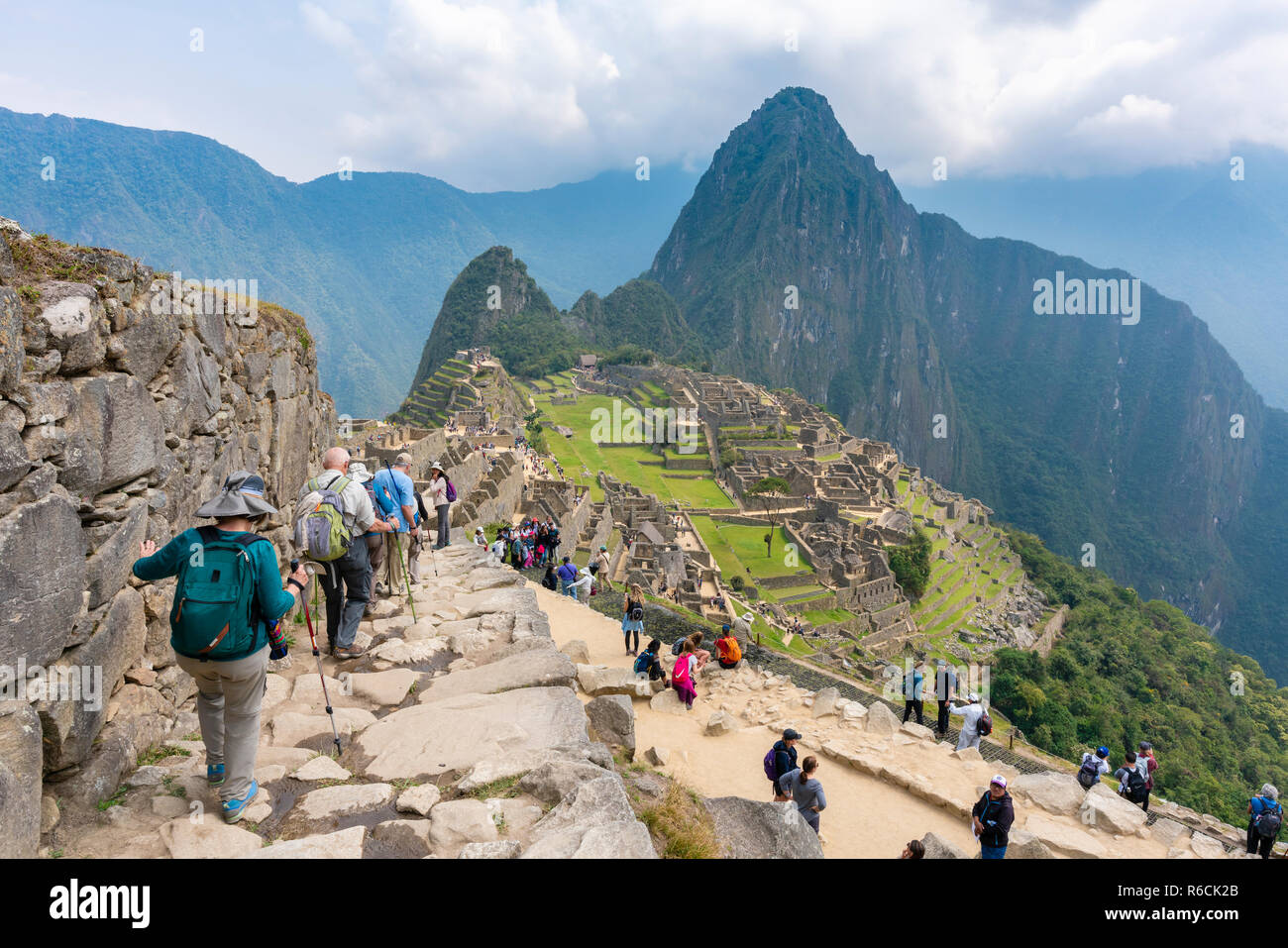 Tourist visiting Machu Picchu in Peru Stock Photo - Alamy