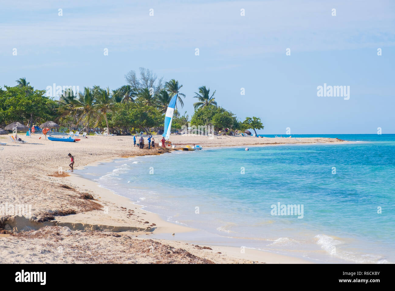 Beautiful white sand and blue ocean in the beach scene from Cuba Stock ...