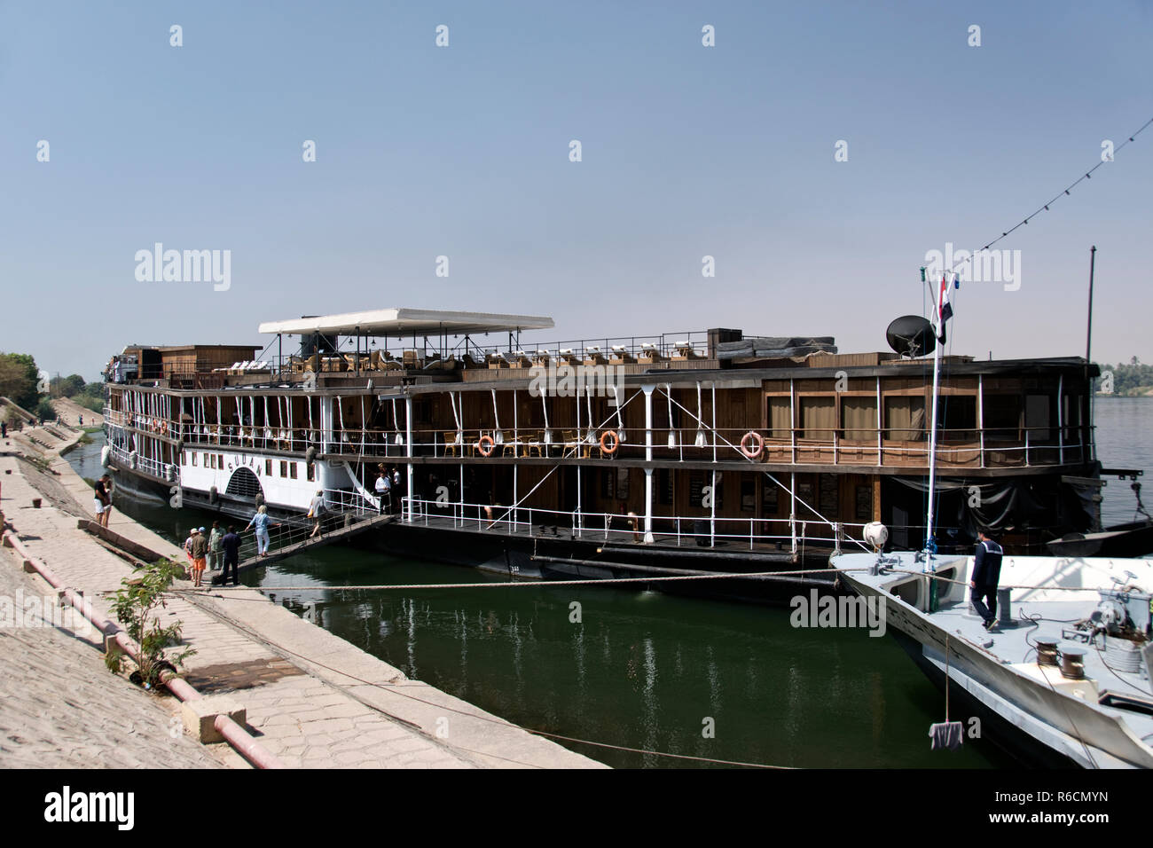 Tourists board the antique steamship MS Sudan, a Nile cruise ship ...