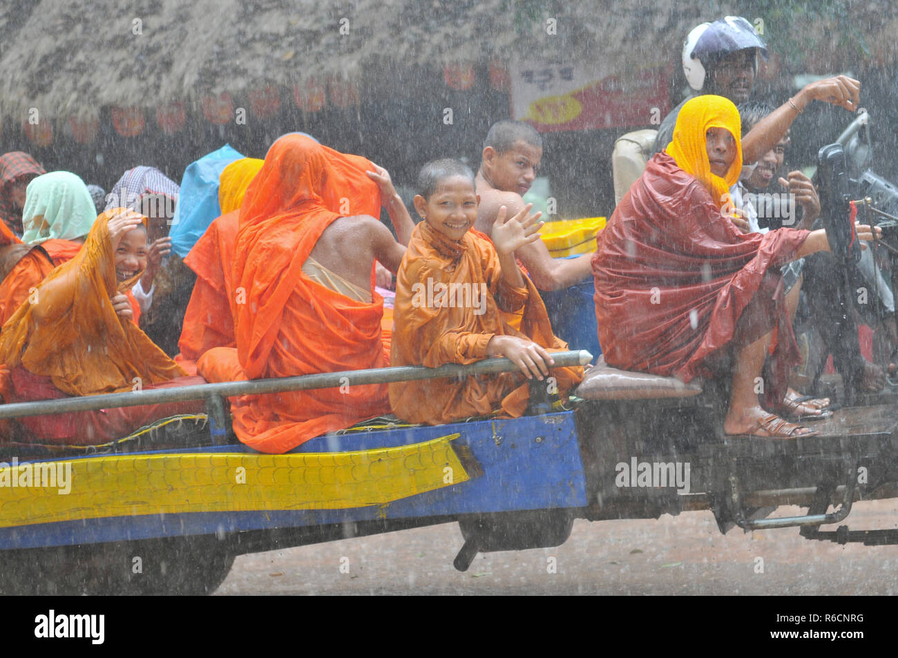 Cambodia, Siem Reap, Monks In The Rain Stock Photo - Alamy