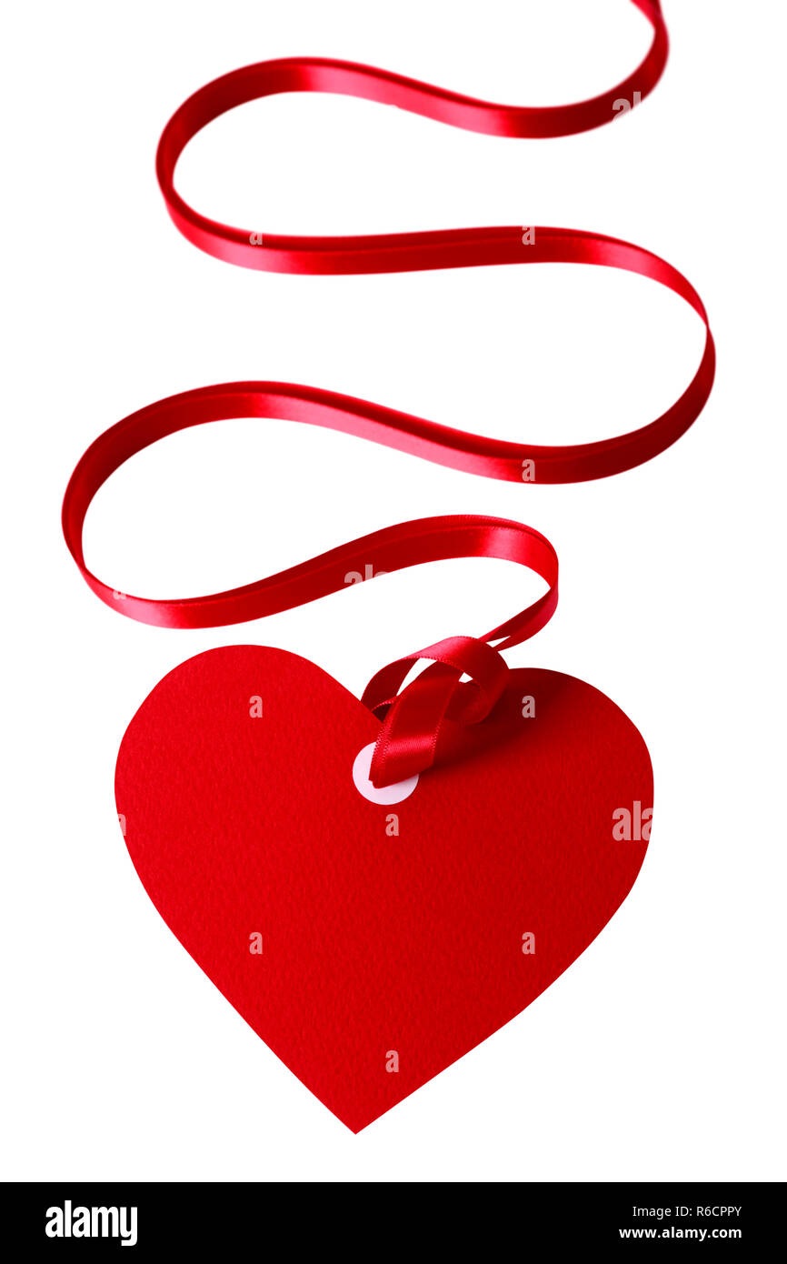 Valentine card or heart shaped gift tag with red ribbon isolated on a ...