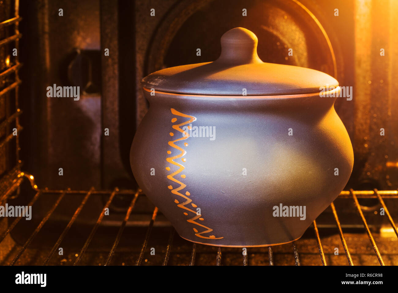 closed ceramic pot in electric oven Stock Photo - Alamy