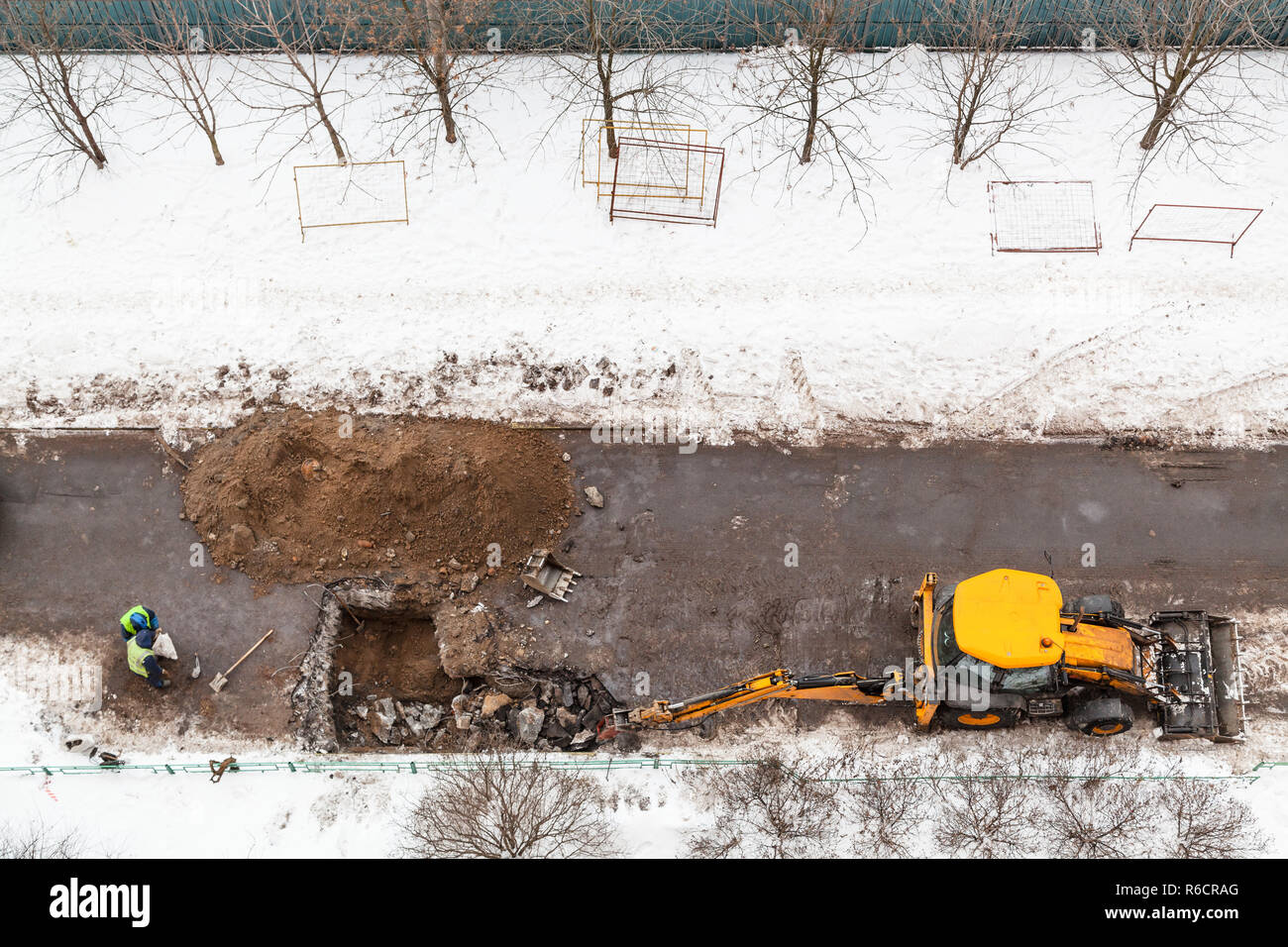 top view of workers and excavator digging road Stock Photo - Alamy