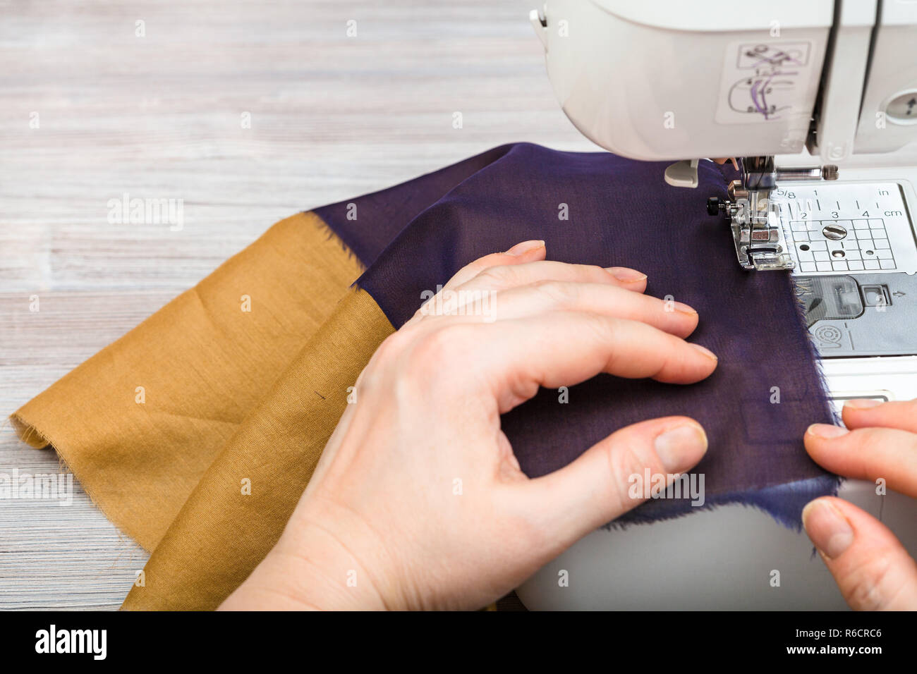 designer stitchs strips of fabrics for patchwork Stock Photo - Alamy
