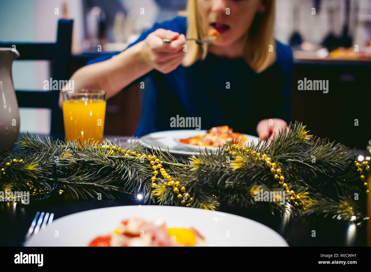 woman eating homemade food, of own preparation fried egg. breakfast for ...