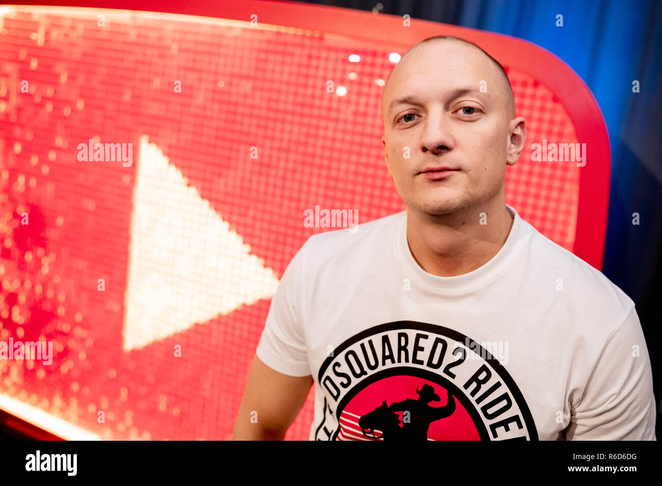 Berlin, Germany. 05th Dec, 2018. The rapper Olexesh stands in front of ...