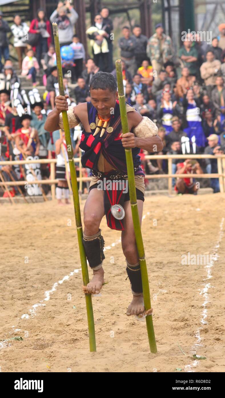 Kisama, India, Dec 05, 2018: A members of a Naga tribes complete in a ...