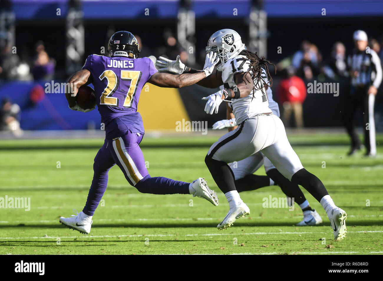 Baltimore, Maryland, USA. 26th Jan, 2016. CYRUS JONES (27) stiff arms ...