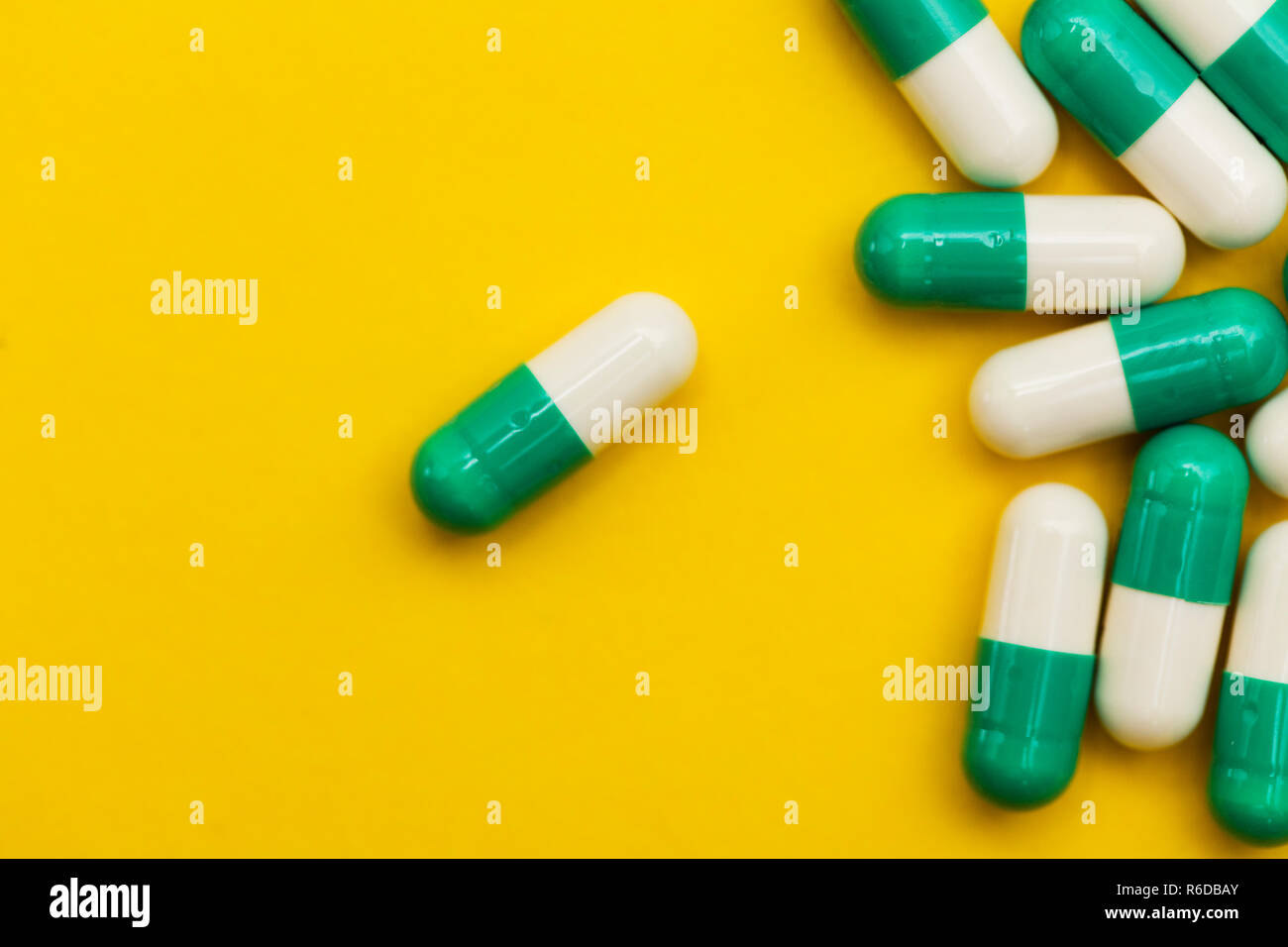 Prescription antibiotic drug medication pills on a bright colourful ...