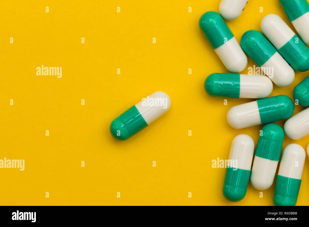 Prescription antibiotic drug medication pills on a bright colourful ...