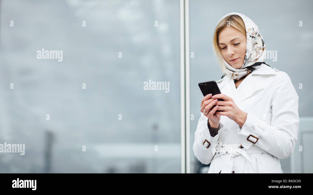 Close up view young woman in a big city using phone with copy s Stock ...