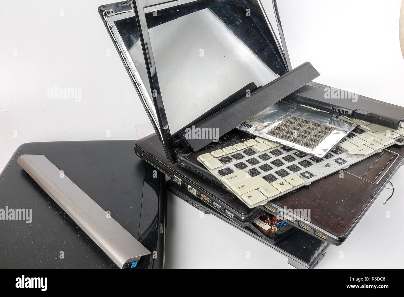 Obsolete laptops isolated on white Stock Photo - Alamy