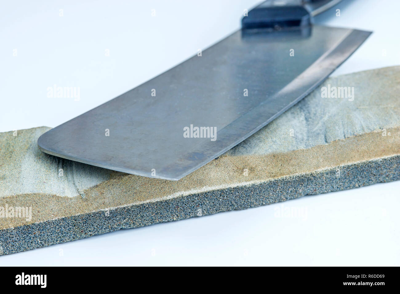 Sharping Stone With A Kitchen Axe Stock Photo - Alamy