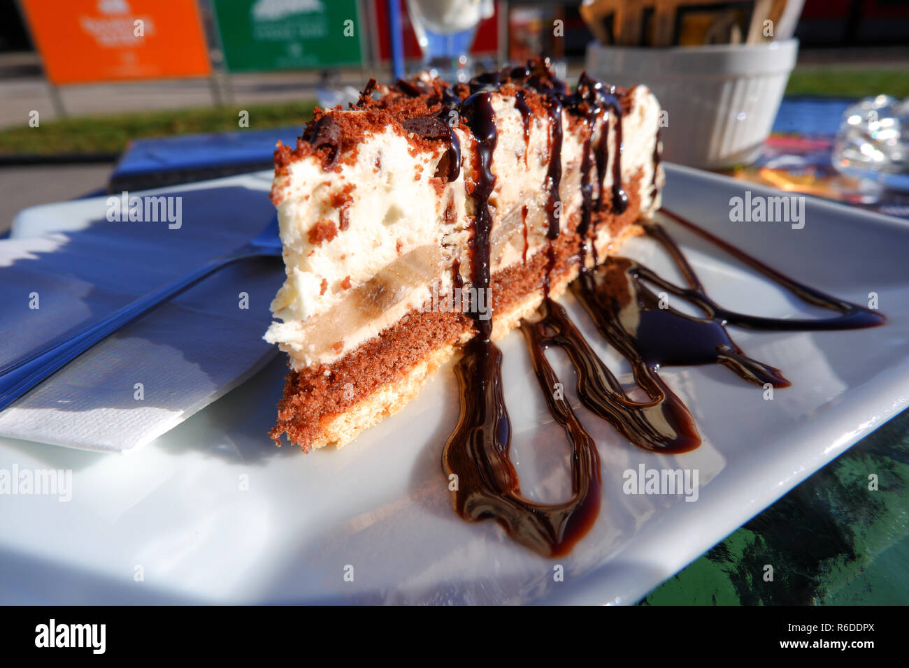 chocolate cake with icing on cafe latte Stock Photo - Alamy