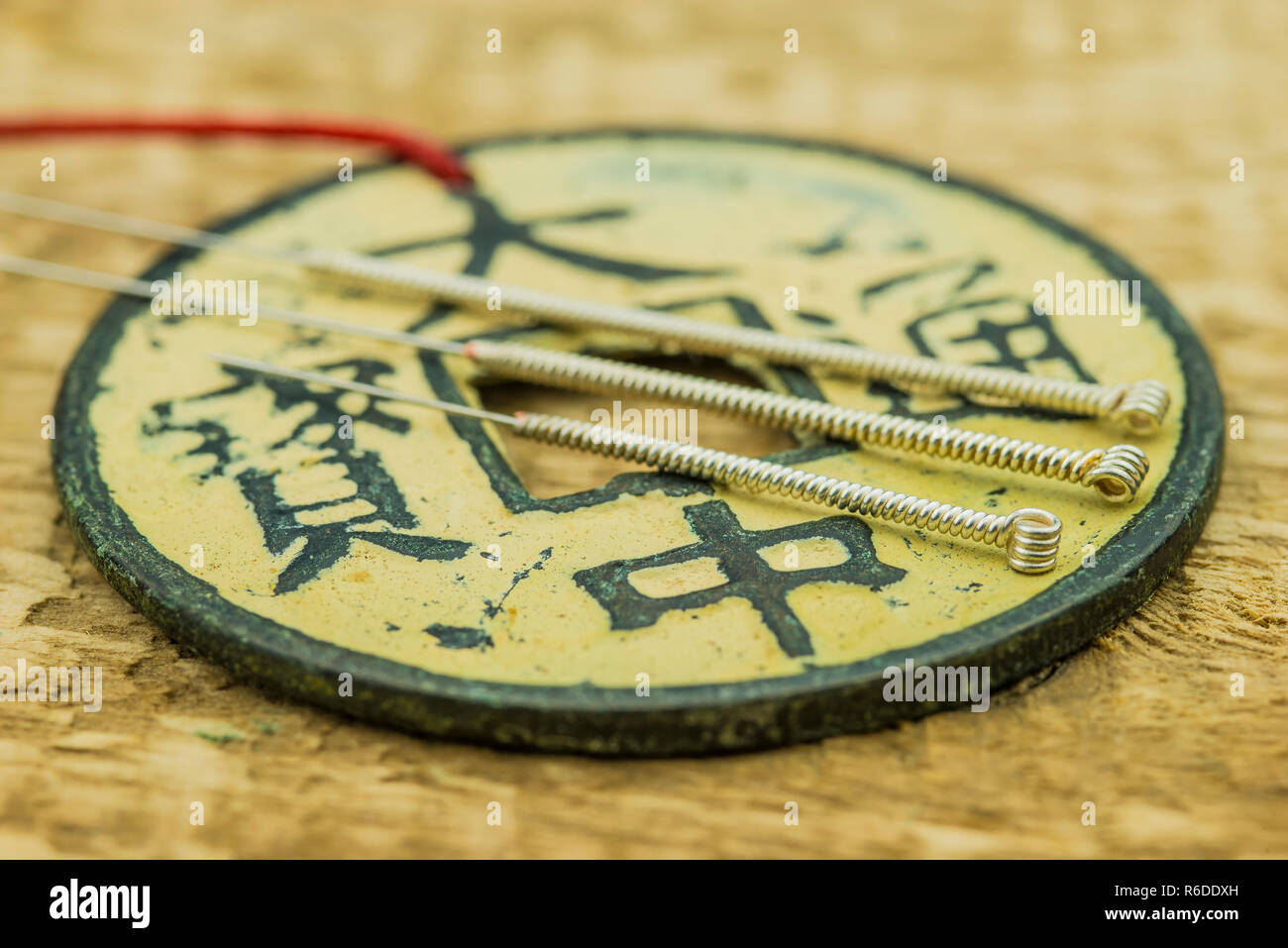 Acupuncture Needles With Antique Chinese Coin Stock Photo - Alamy