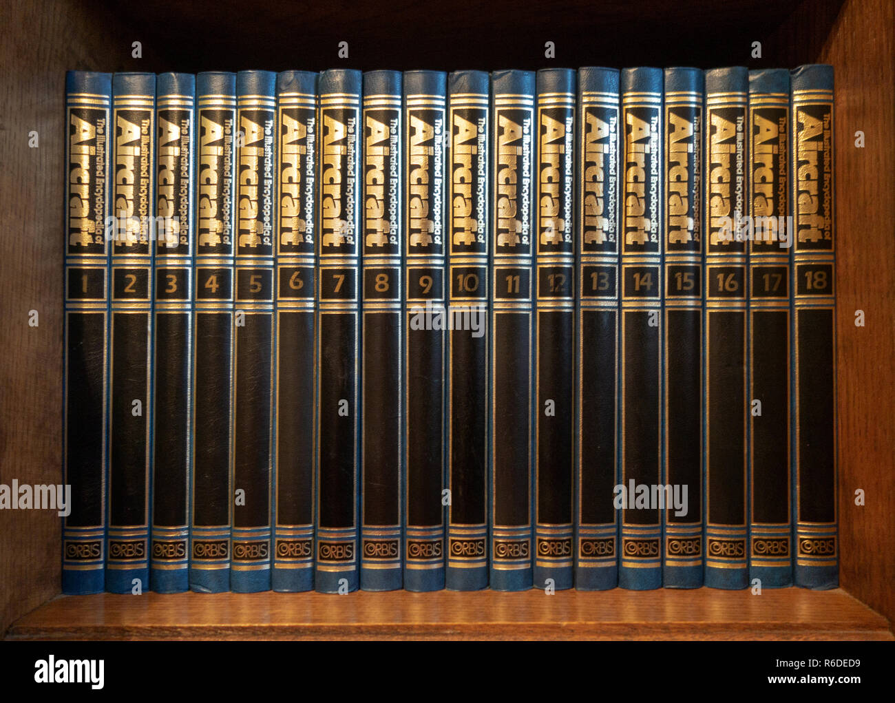 Set of illustrated Encyclopedia of Aircraft on a book shelf in an ...