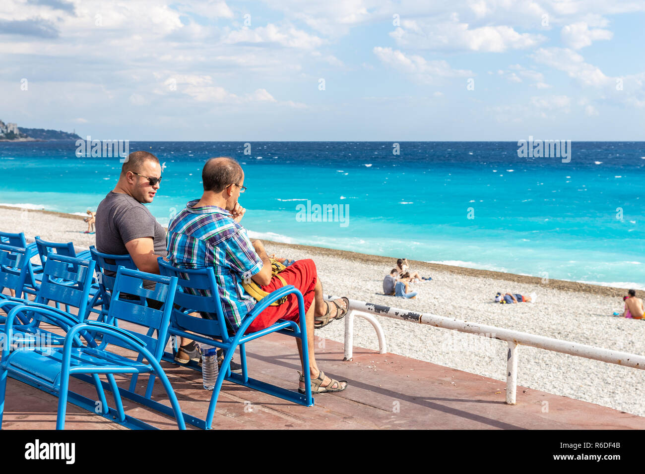 Nice, France - October 1, 2018: People relaxing on public bench at ...