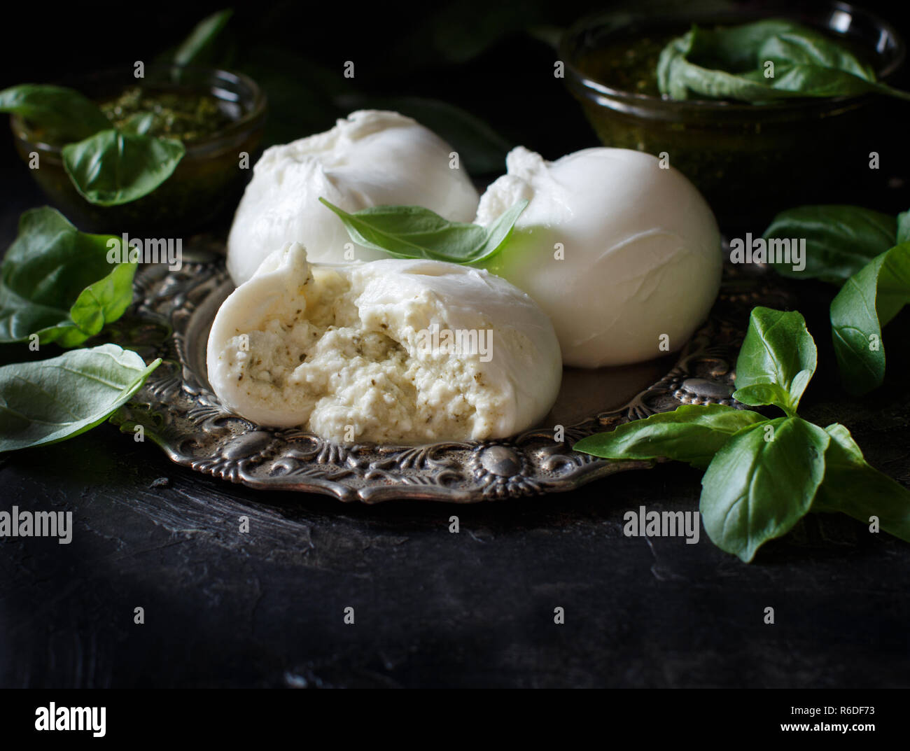 Italian mozzarella cheese stuffed with ricotta and persto Stock Photo ...