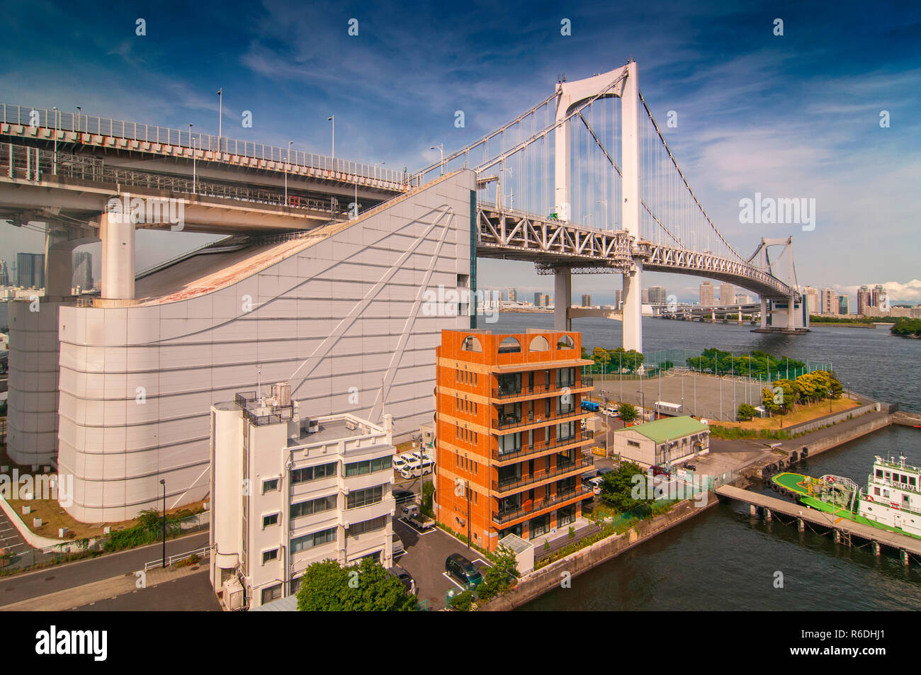 Rainbow Bridge With Modern Buildings Background In Tokyo, Japan Stock ...