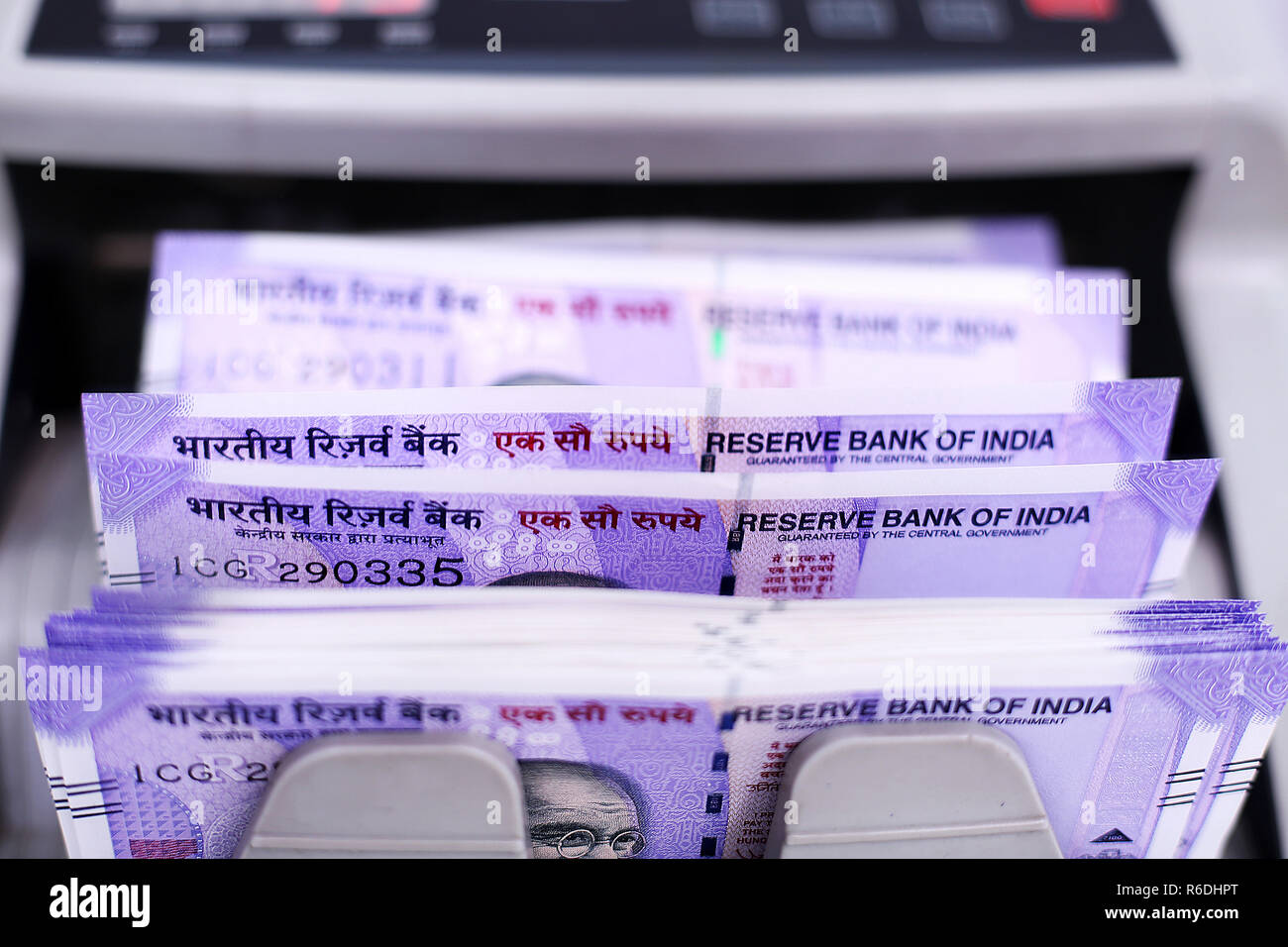 Automatic money counting in the machine. Isolated on the white ...